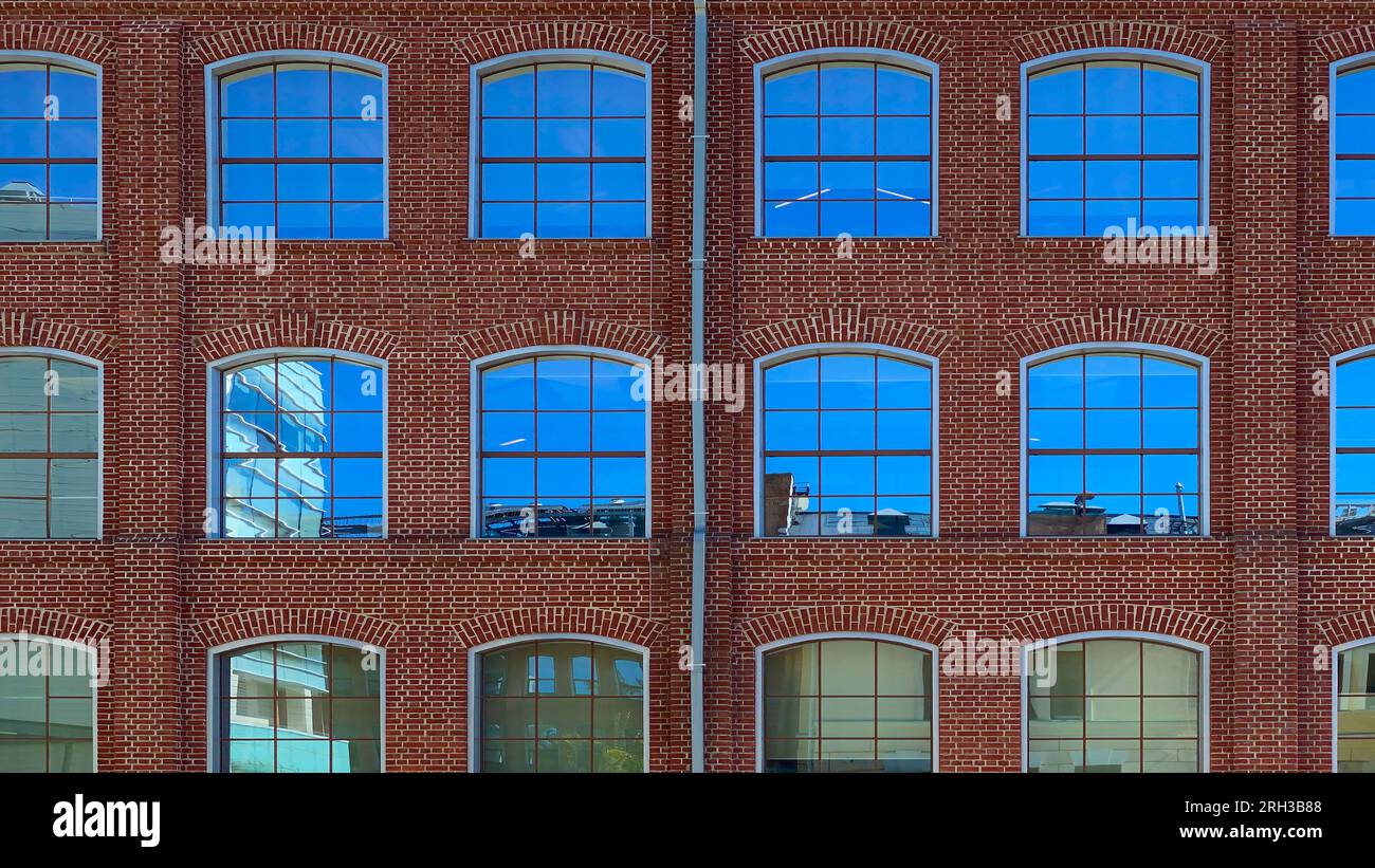 Old Industrial building from red bricks with metal rain pipes Stock ...