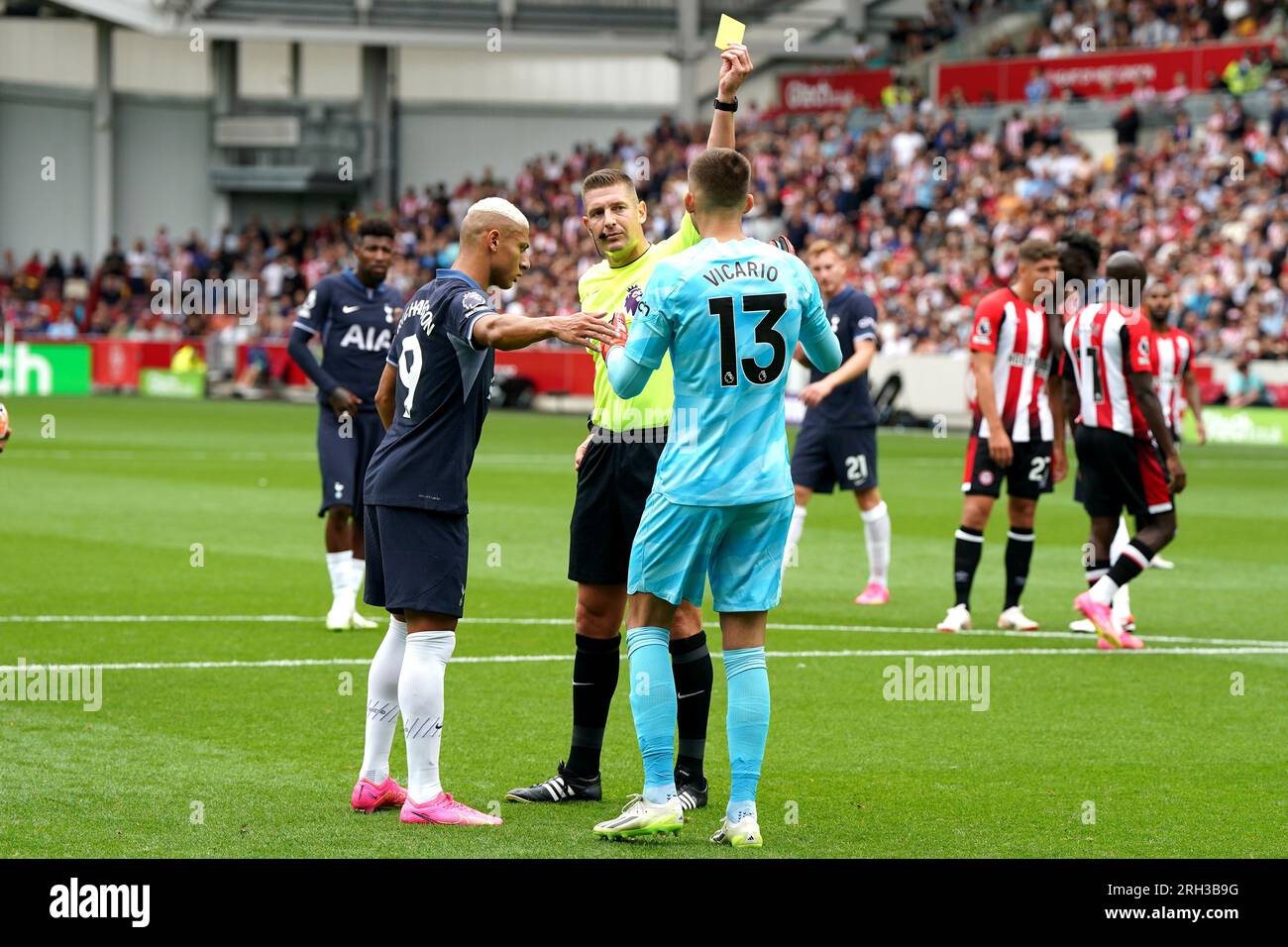 Tottenham Hotspur goalkeeper Guglielmo Vicario (right) is shown a ...