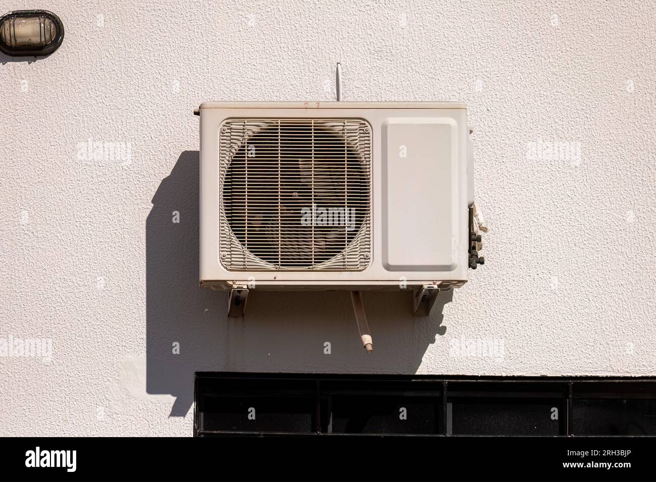 air conditioning condenser installed on a white wall Stock Photo - Alamy