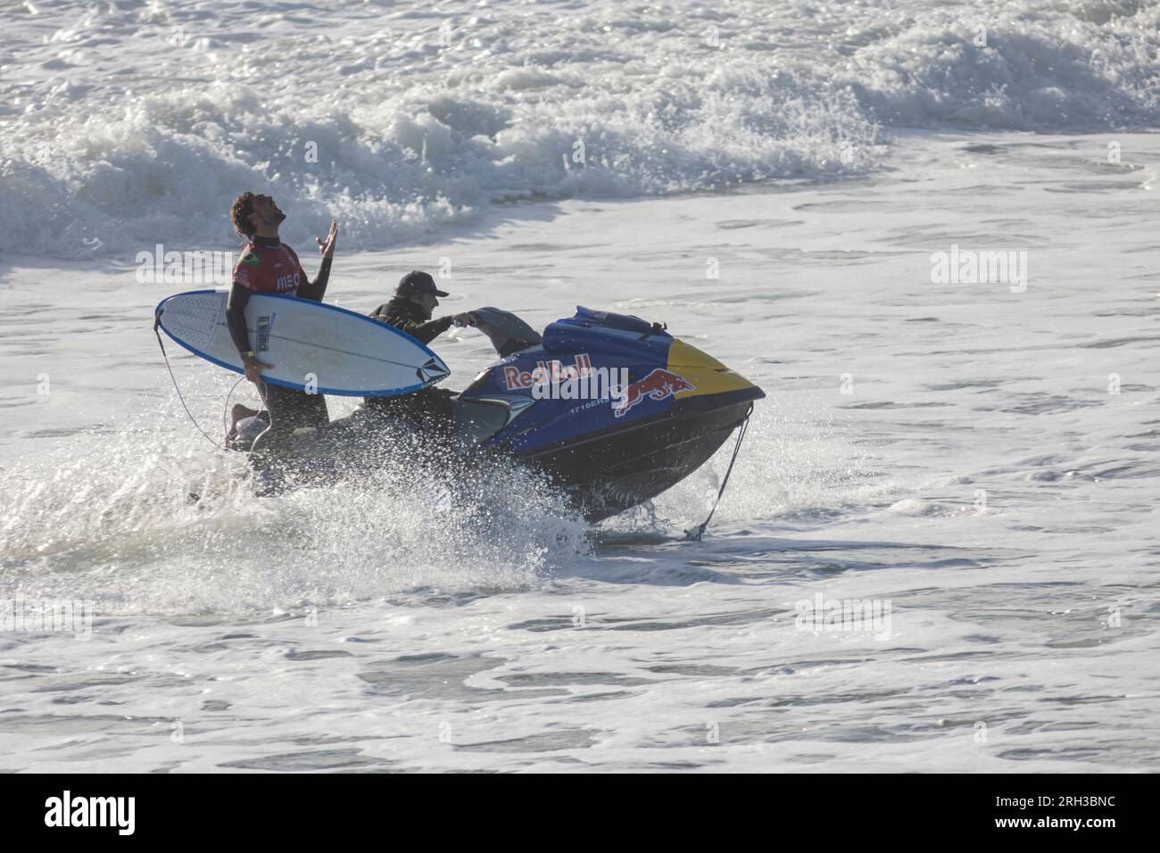 14 march 2023 Peniche, Portugal: surf competition - two men one holding ...