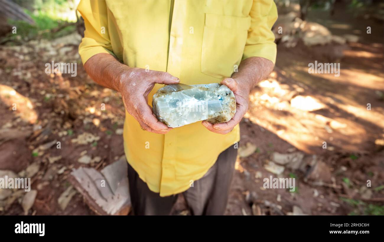 Man with crystal mineral stone hi-res stock photography and images - Alamy