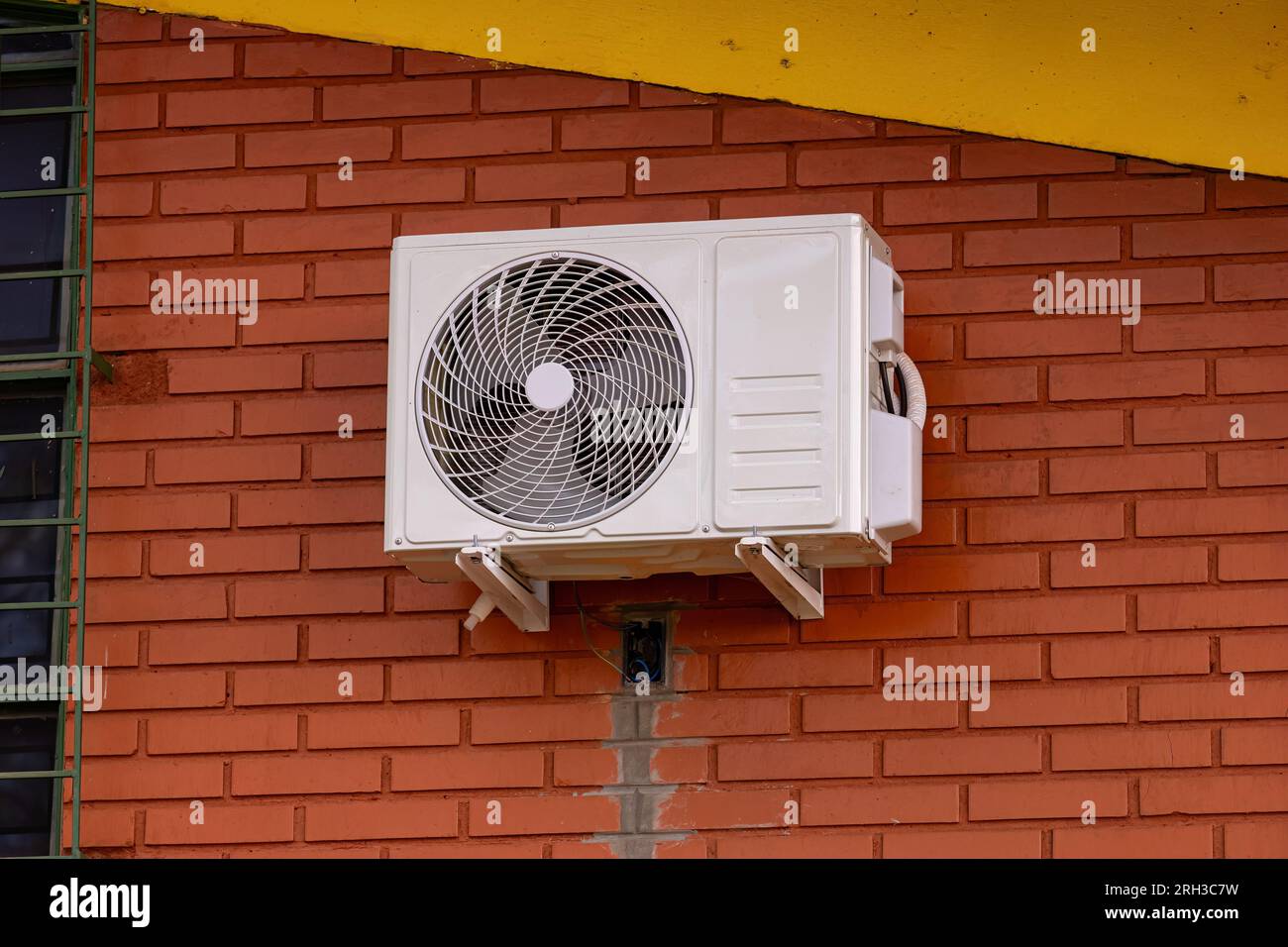 air conditioning condenser installed on a white wall Stock Photo - Alamy