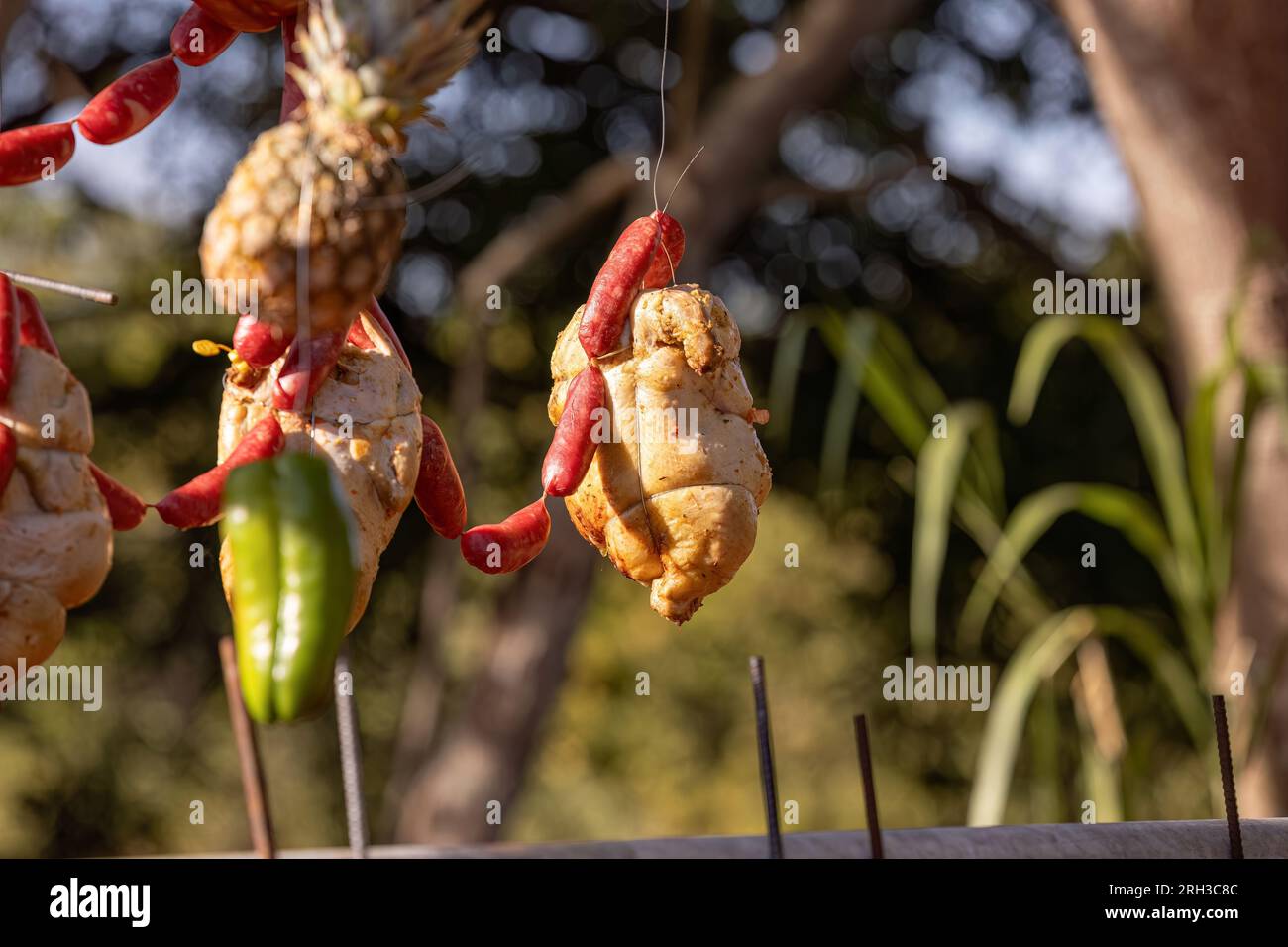 Hanging roast chicken hi-res stock photography and images - Alamy