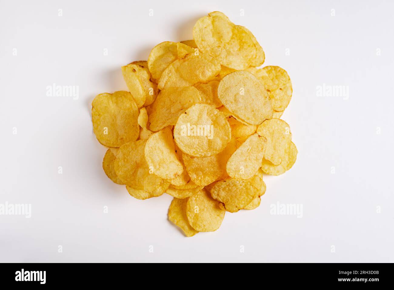 Small heap of chips on white background Stock Photo - Alamy