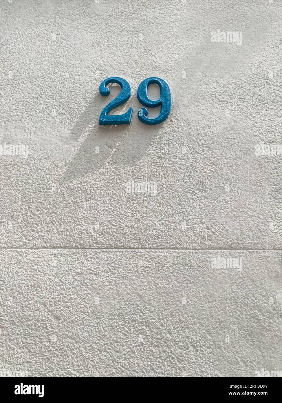 House number 29, blue painted iron over wall. Houses with personality ...
