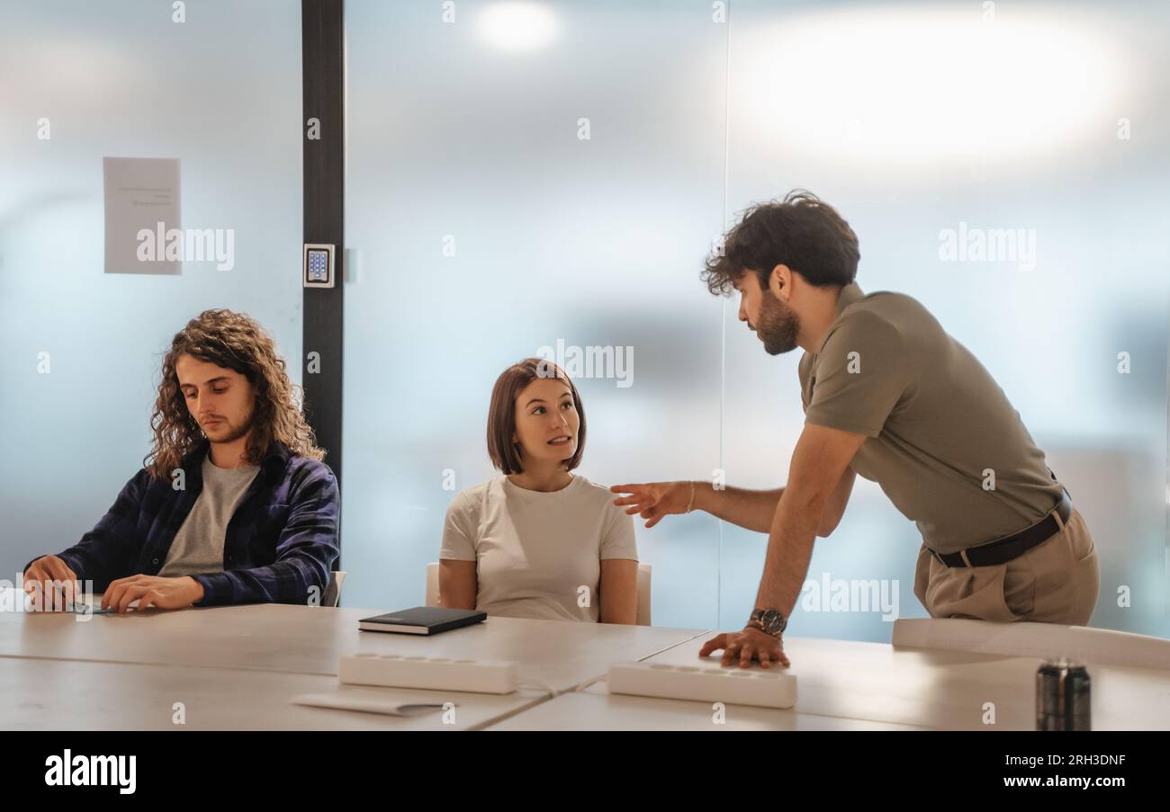 Reacting to bad situation at work. Male employee telling bad situation ...