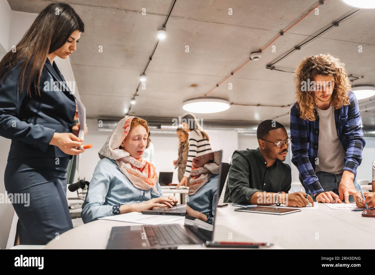 Multicultural female employee having issues with her daily tasks at ... Multicultural female employee having issues with her daily tasks at ...