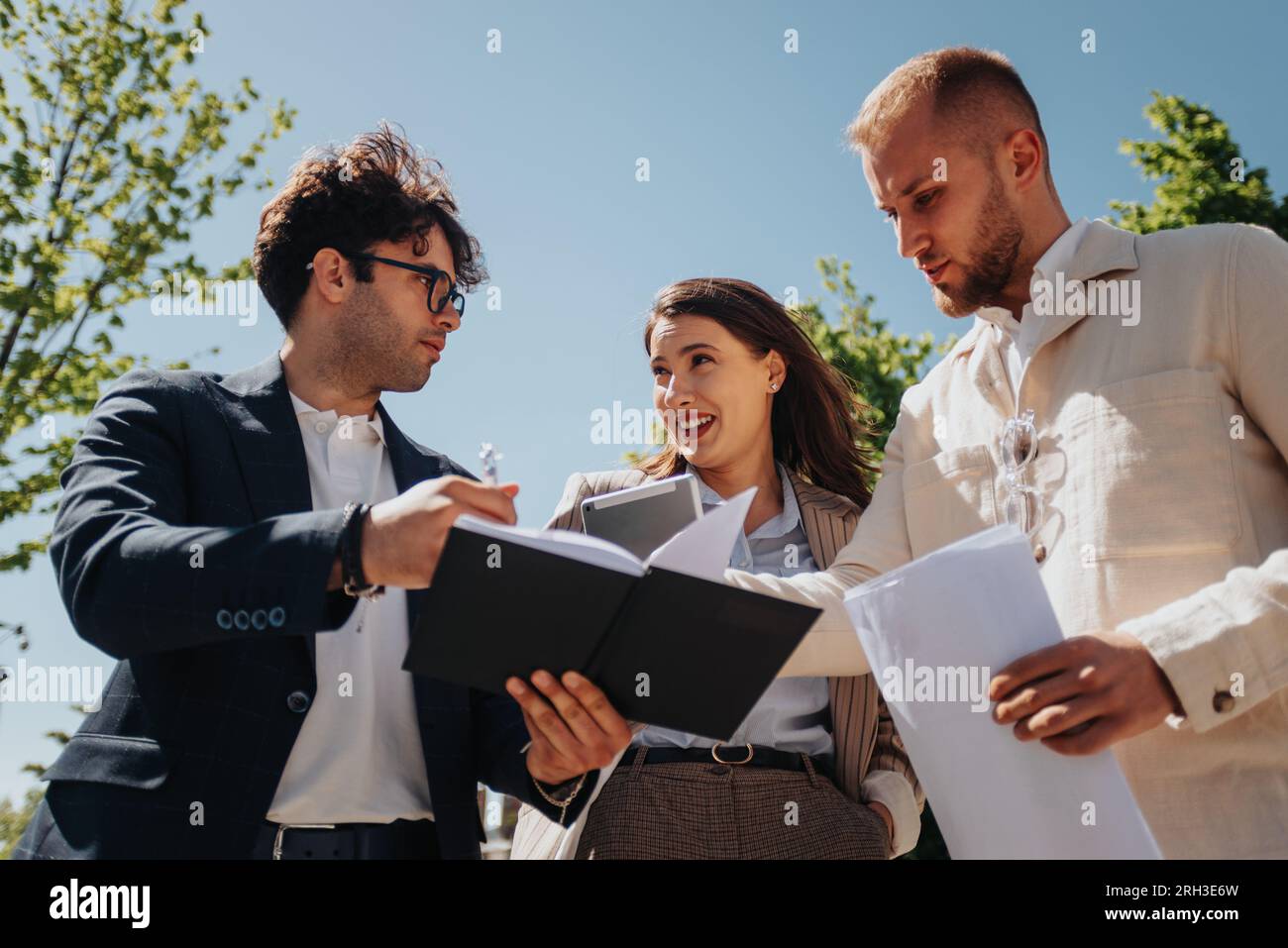 Focused business people creating plan for the new project while working ...