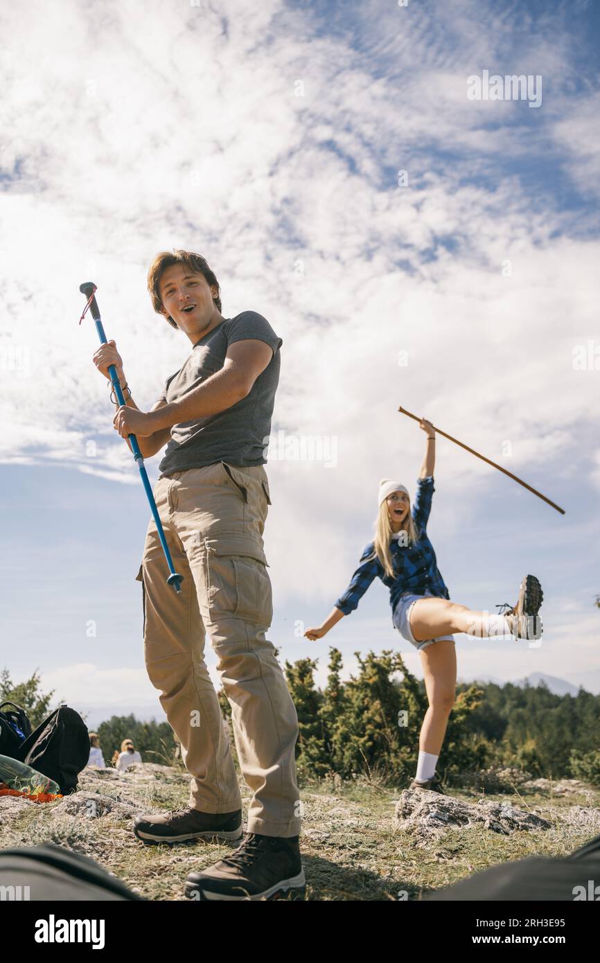 Two hikers having fun at the top of the mountain Stock Photo - Alamy