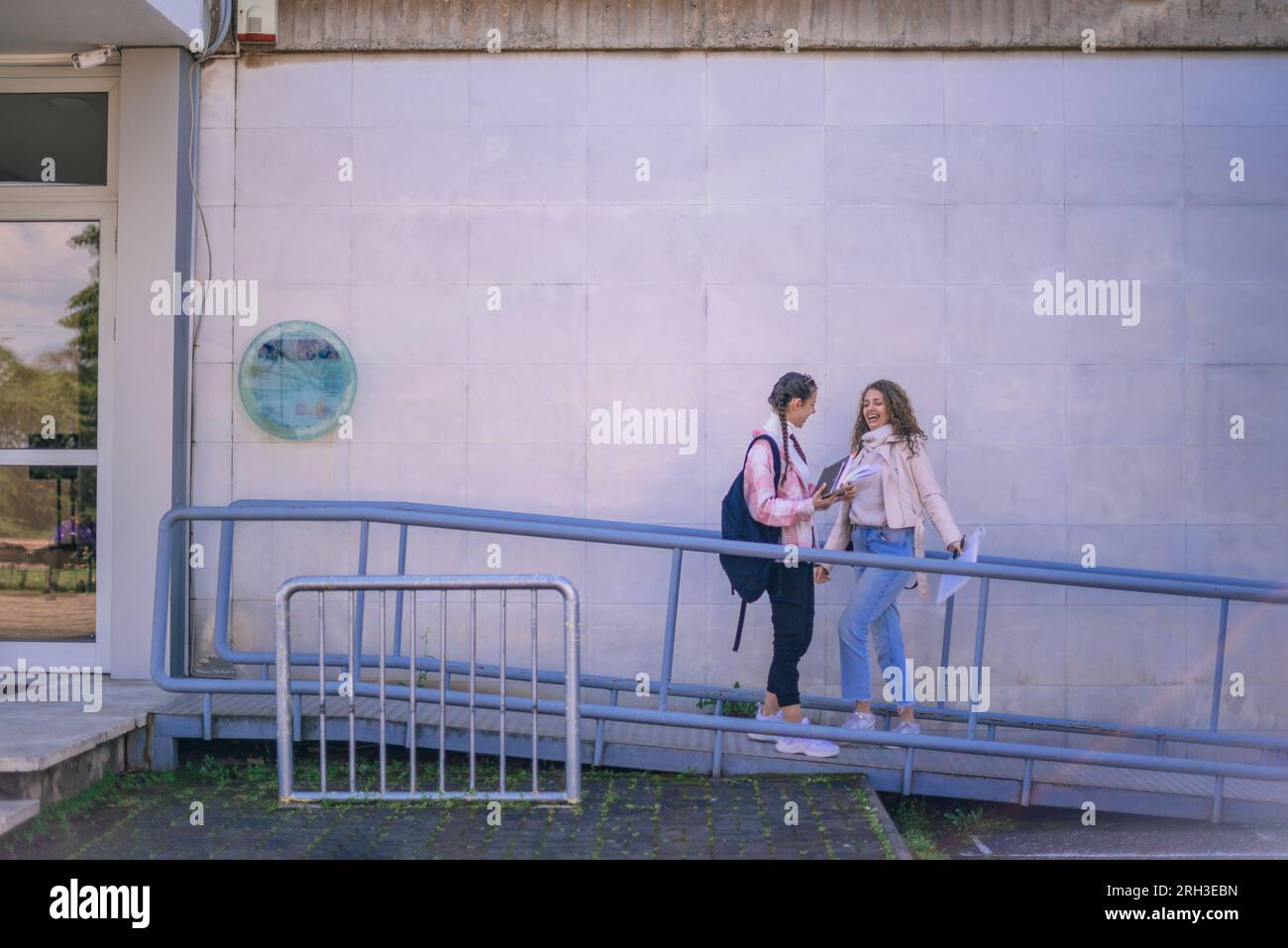 Two happy school girls after successfully finished exam Stock Photo - Alamy