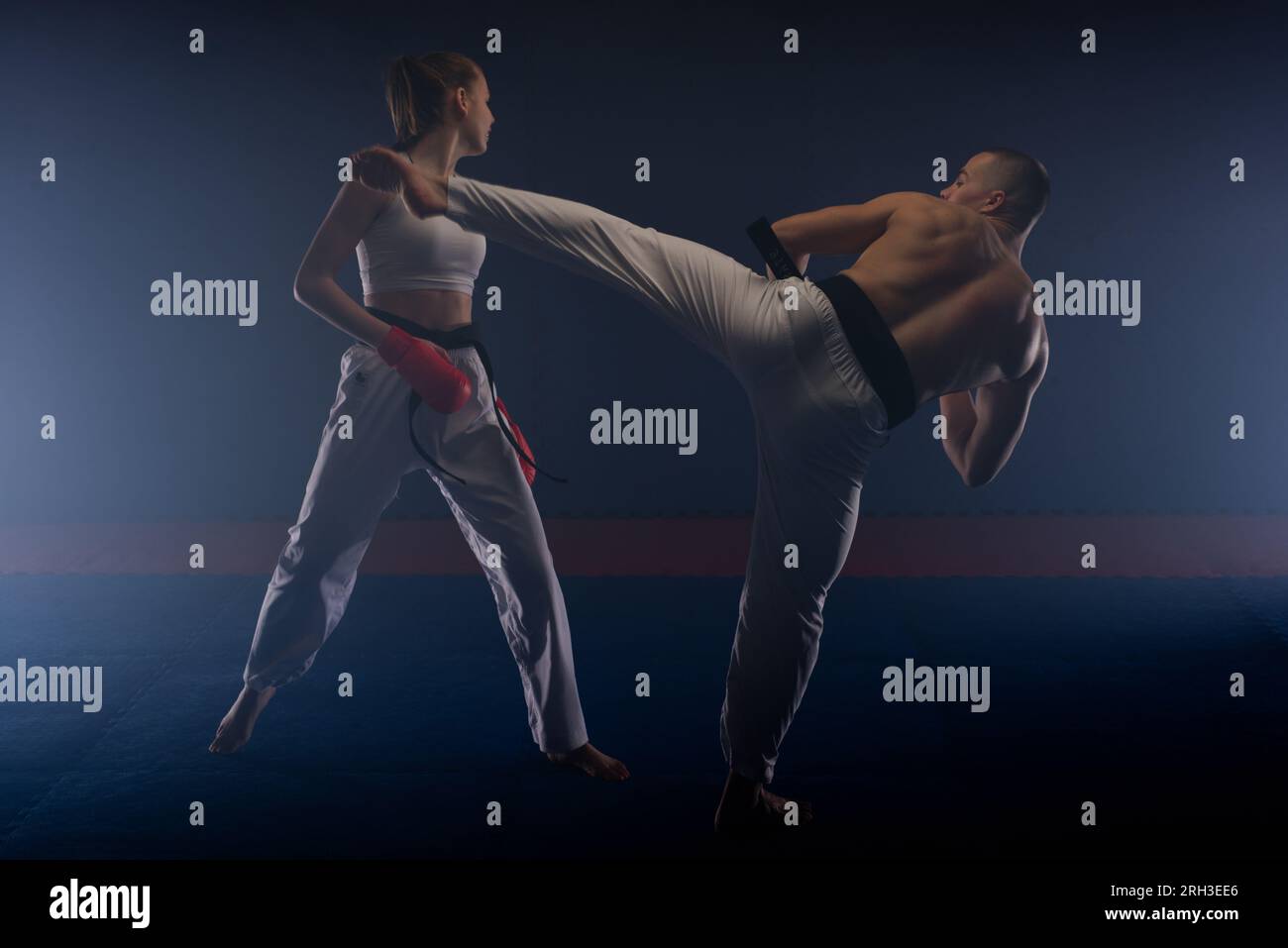 Two good looking karate kids doing the Ura Mawashi Geri practice at the ...