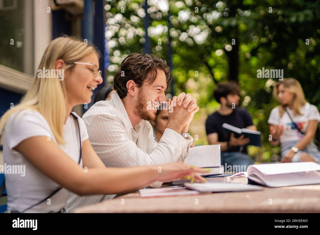 Beautiful students laughing during break, they are having fun ...