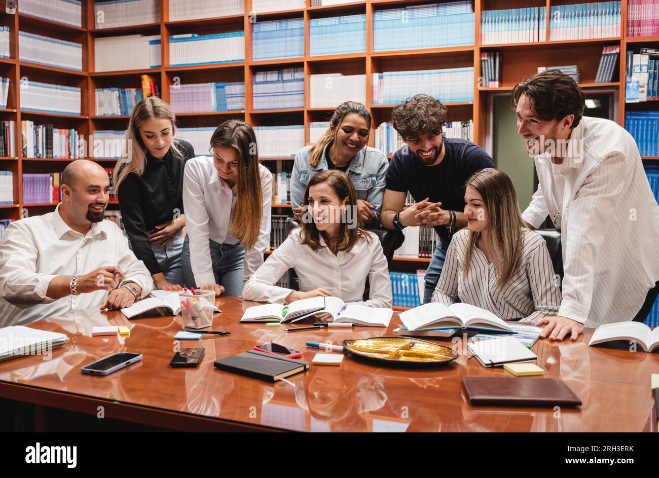 Students helping each other in class hi-res stock photography and ...