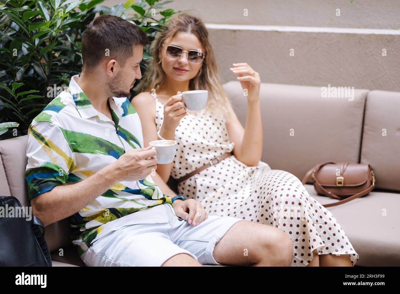 Pretty woman spend time with her boyfriend in cafe Stock Photo - Alamy