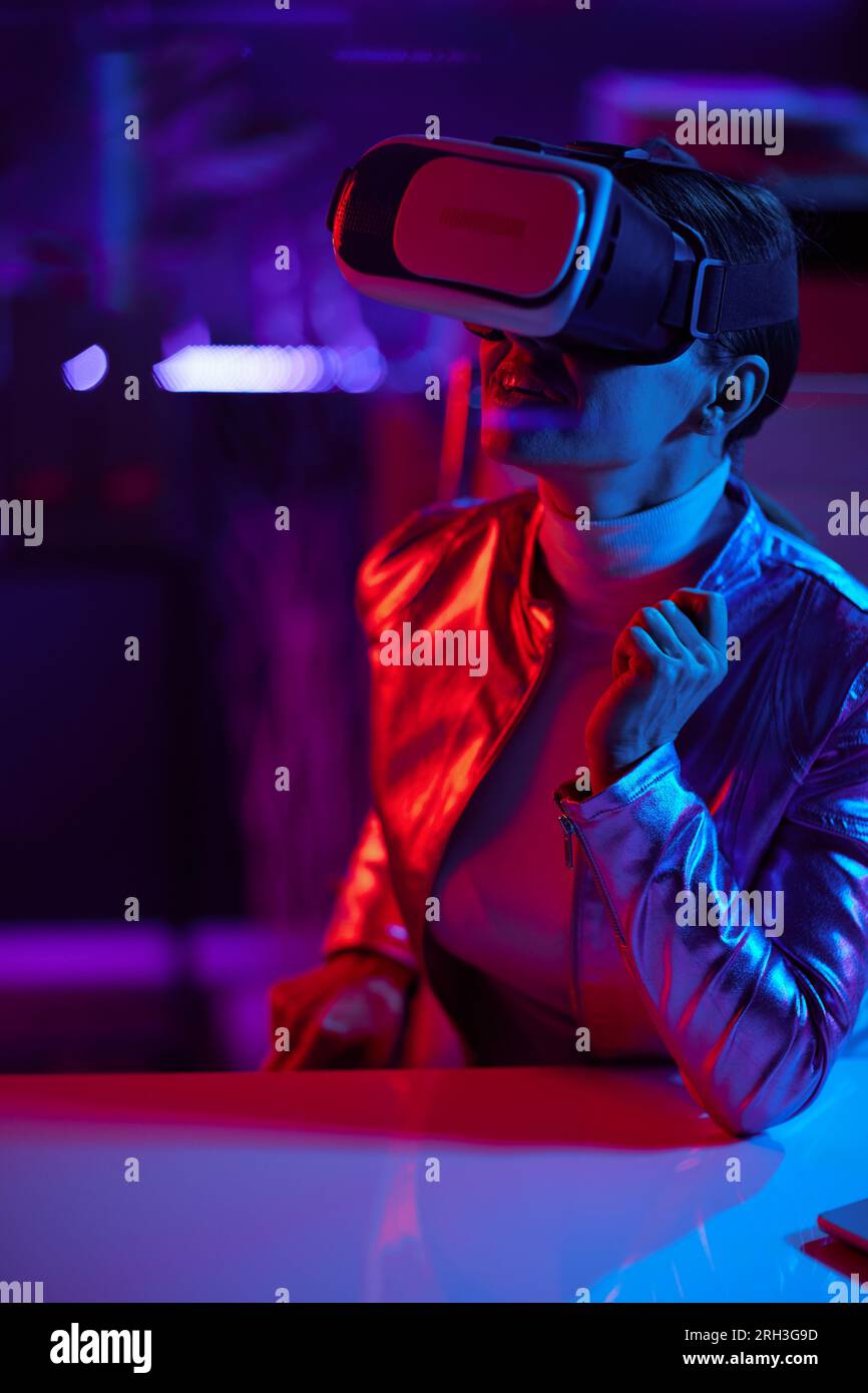 Neon metaverse futuristic concept. smiling stylish 40 years old woman ...