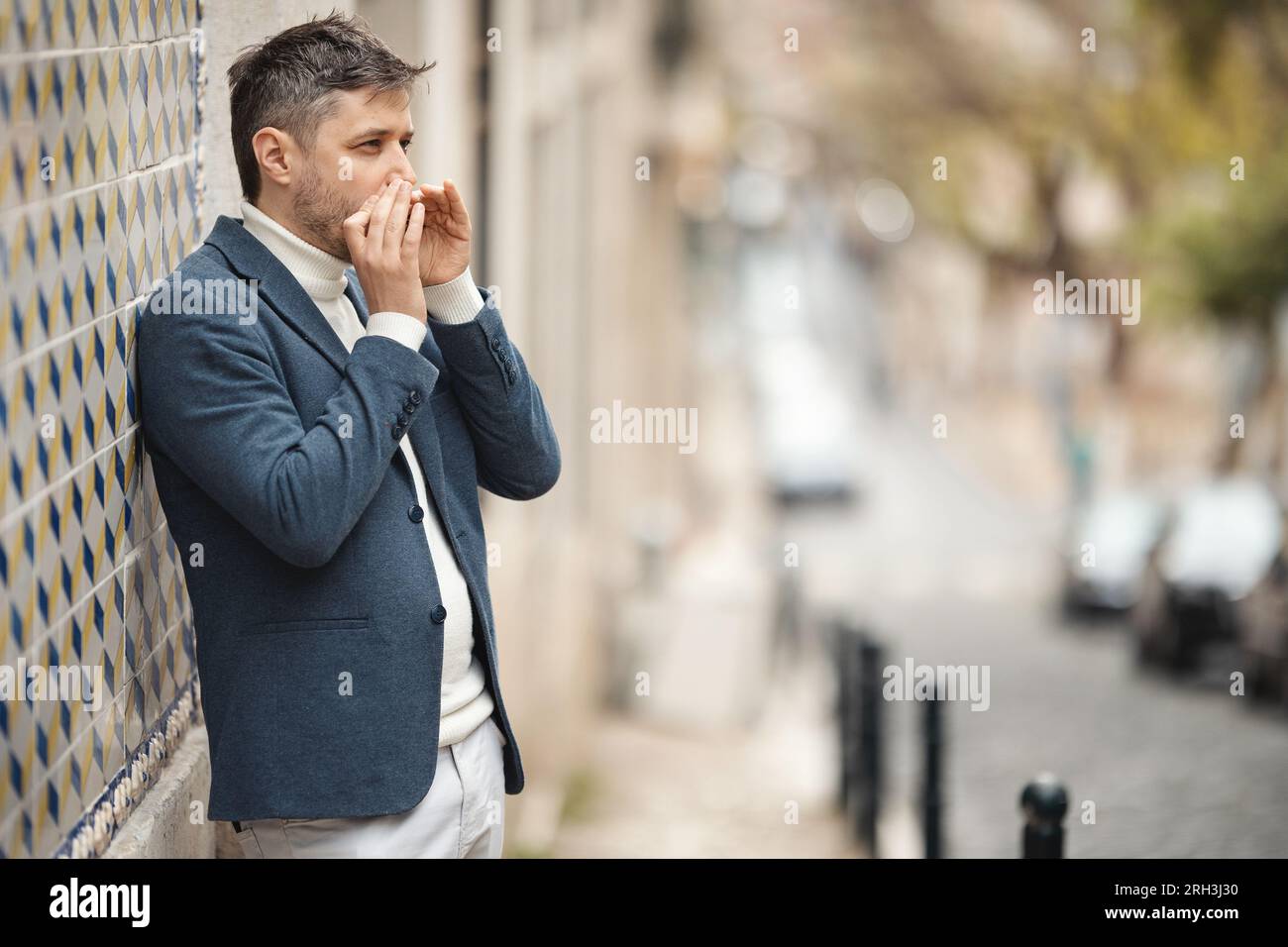 Man stands against wall plays hi-res stock photography and images - Alamy