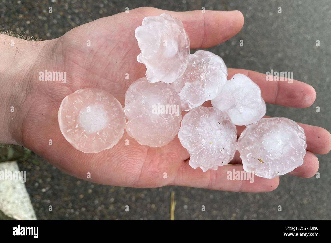 Man holds hail in hand hi-res stock photography and images - Alamy