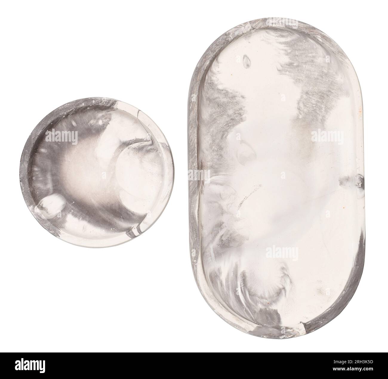 Round and oval cement plates on a white isolated background, top view ...