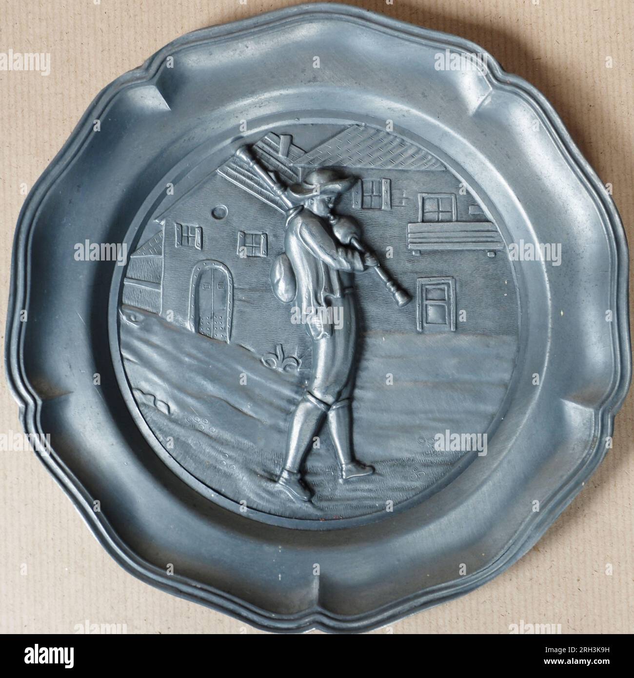 Traditional German antique pewter decorative plate depicting a pied ...