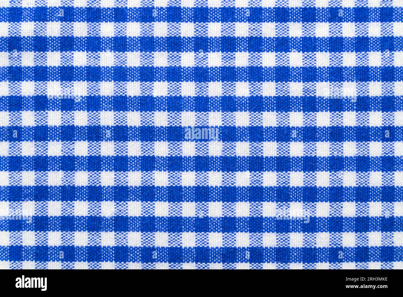 The texture of linen fabric in a large cage of blue and white. Scottish ...