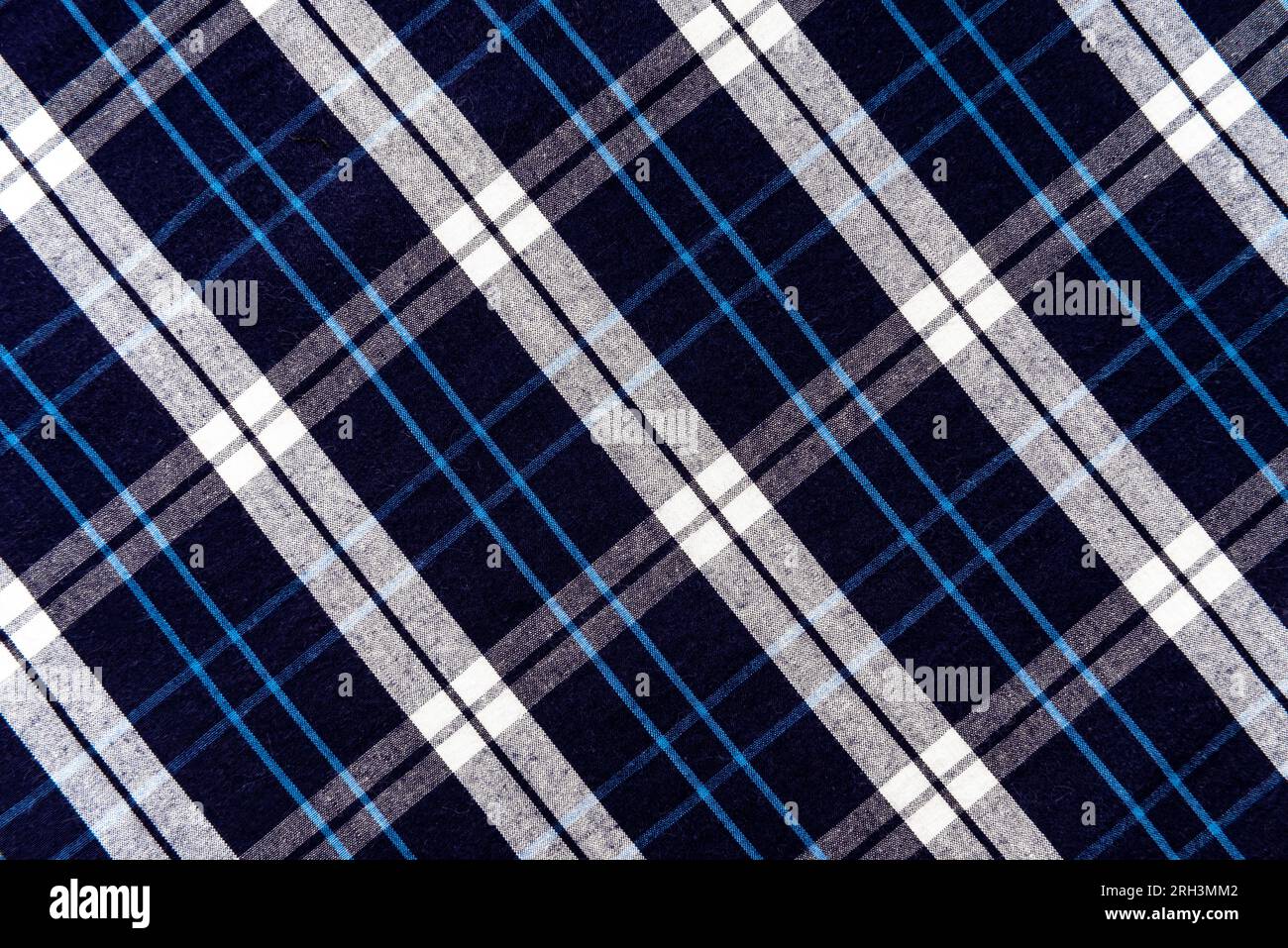 The texture of linen fabric in a large cage of blue and white. Scottish ...