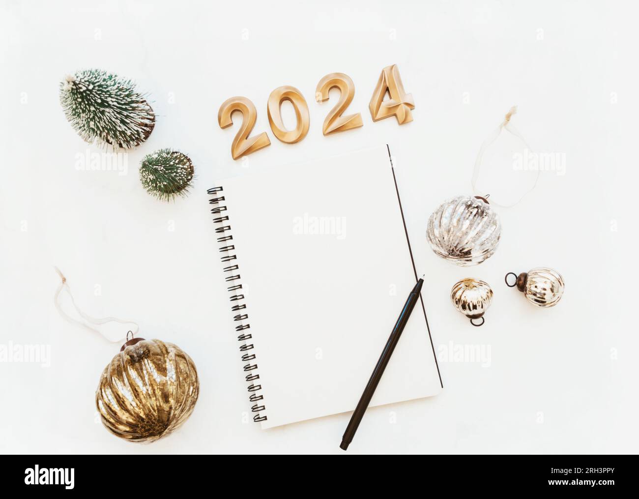 Flat lay of blank notebook sheet with copy space, numbers 2024 ...