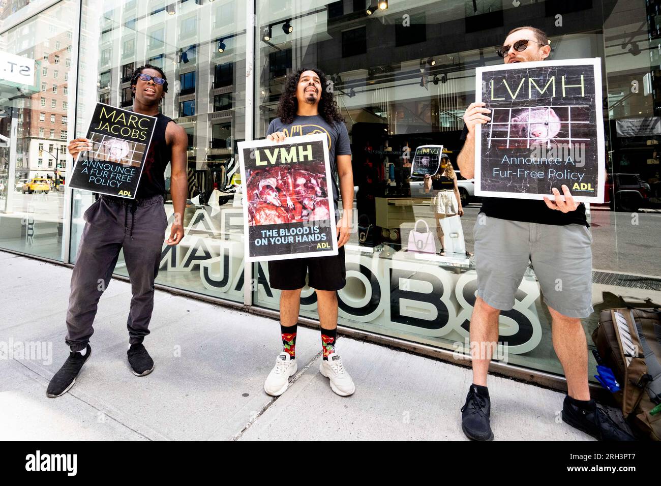 August 13, 2023, New York City, New York, United States: Men holding ...