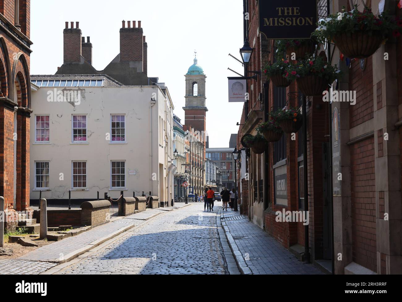 Cobbled street Posterngate lined with historic buildings in Hull's Old ...