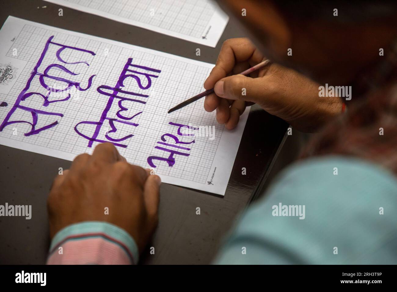 People learn to write letters in Sanskrit Stock Photo - Alamy