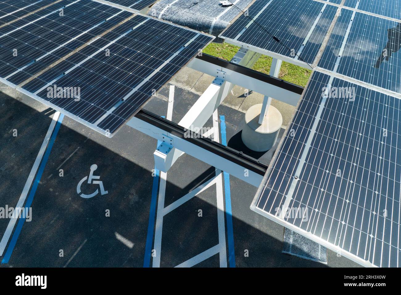 Wind damage to solar panels installed over parking lot canopy shade for ...