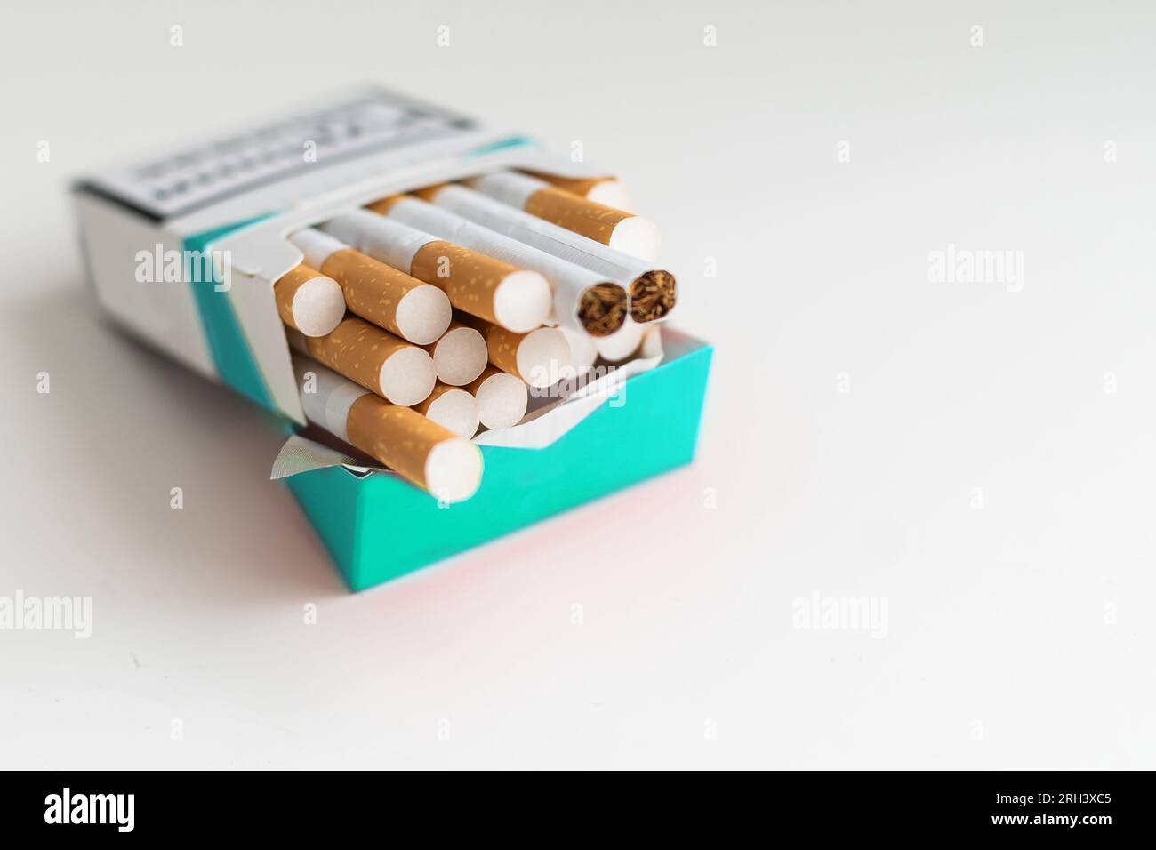 Open blue pack of cigarettes isolated on white background. Box of ...