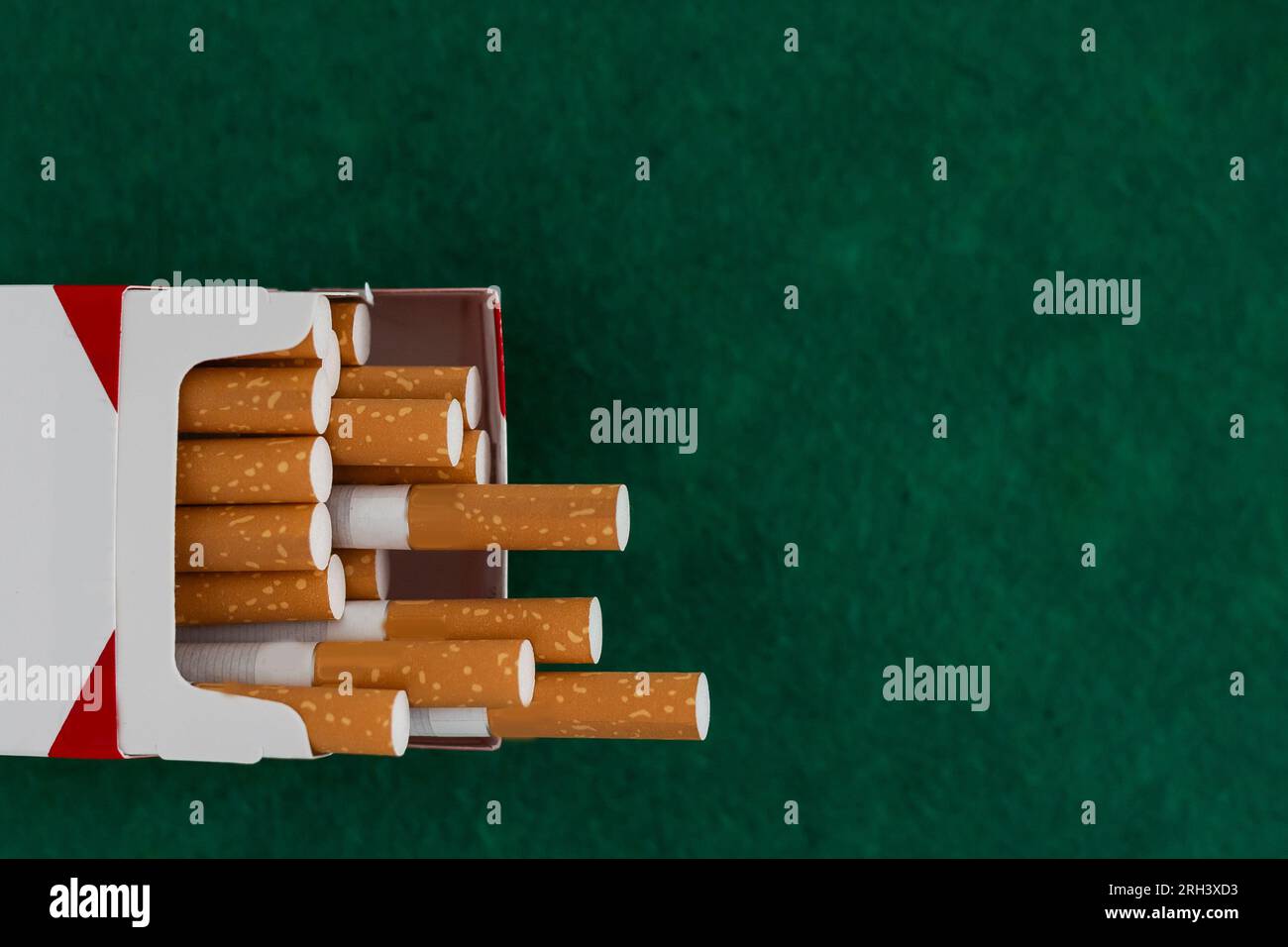 open pack of cigarettes standing isolated green Stock Photo - Alamy