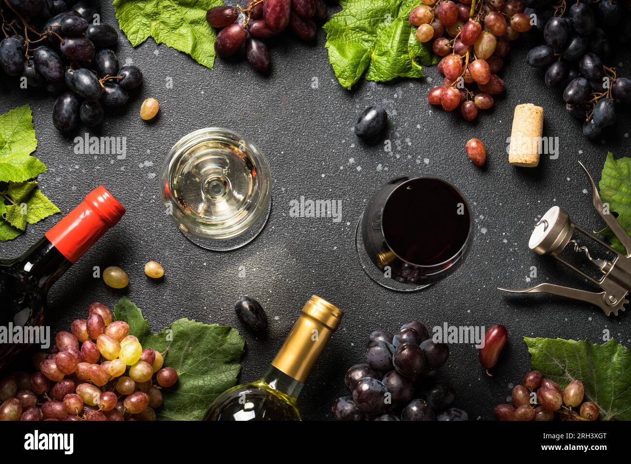 Glass of wine, bottle and fresh crape on black Stock Photo - Alamy