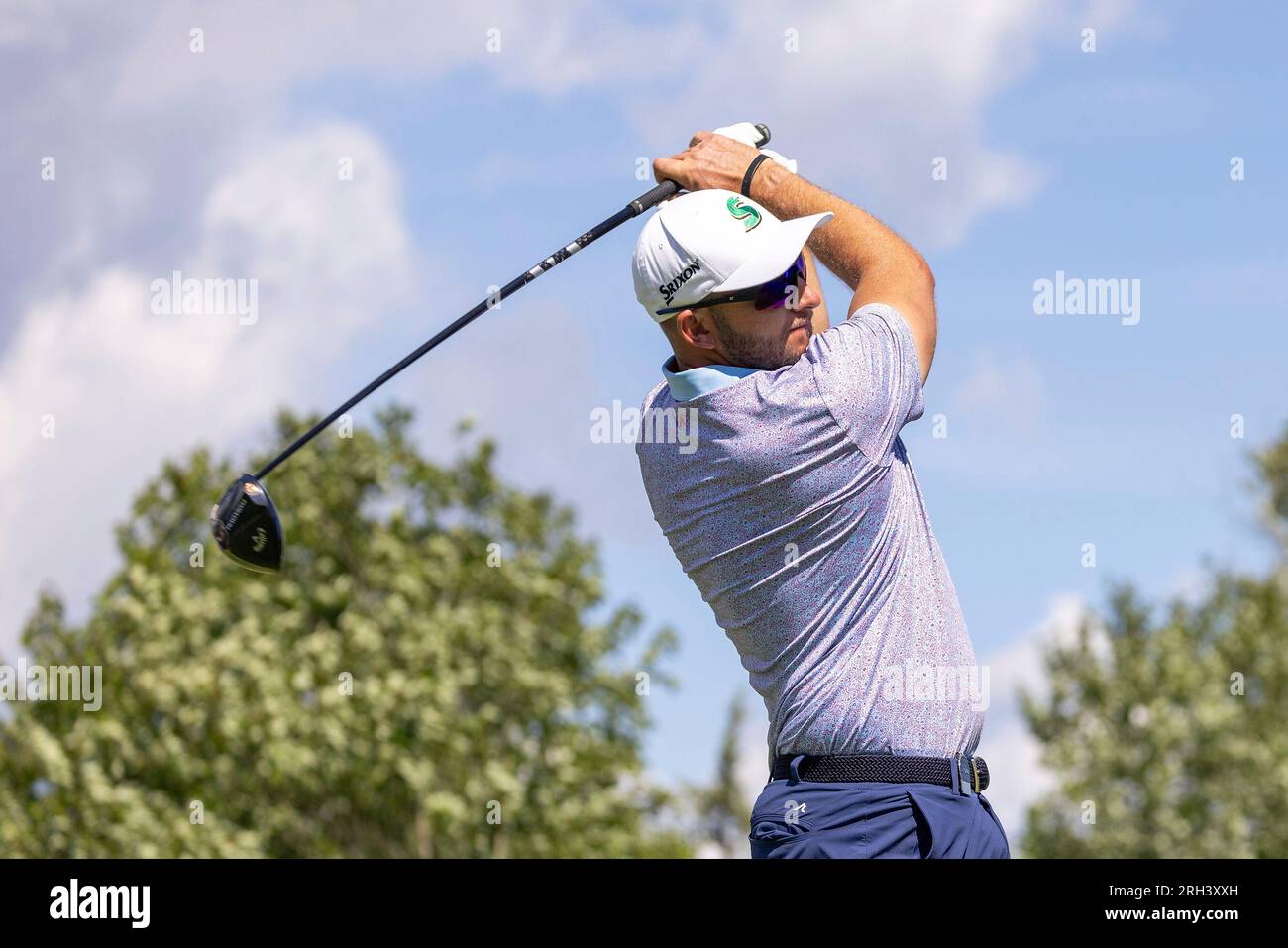 Dean Burmester of Stinger GC hits his shot from the eighth tee during ...
