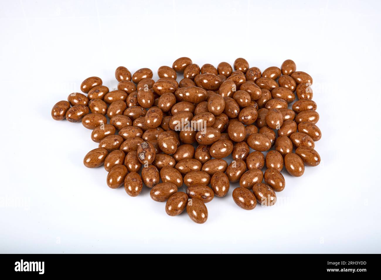 Colored chocolate dreje. Dark chocolate filled hazelnuts. Colorful ...