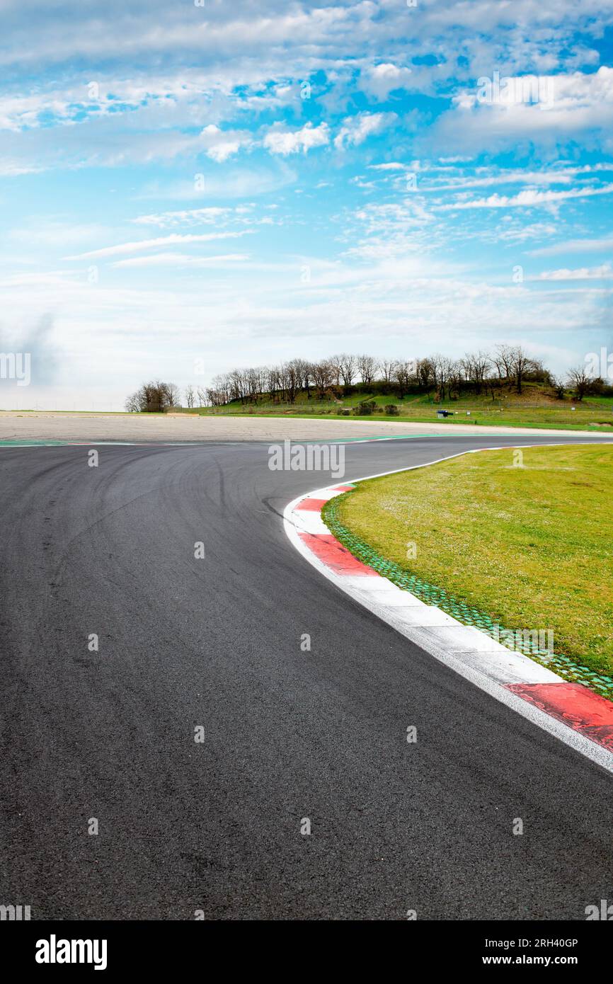 Motor sport asphalt race track and curbs with skid marks, low angle ...