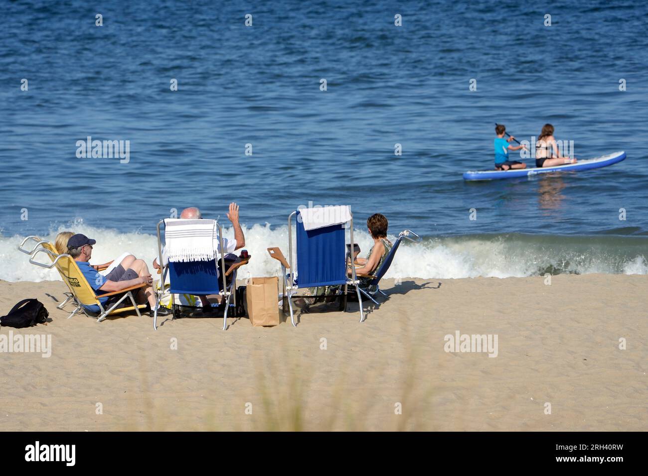 President Joe Biden waves as he and first lady Jill Biden sit with U.S ...