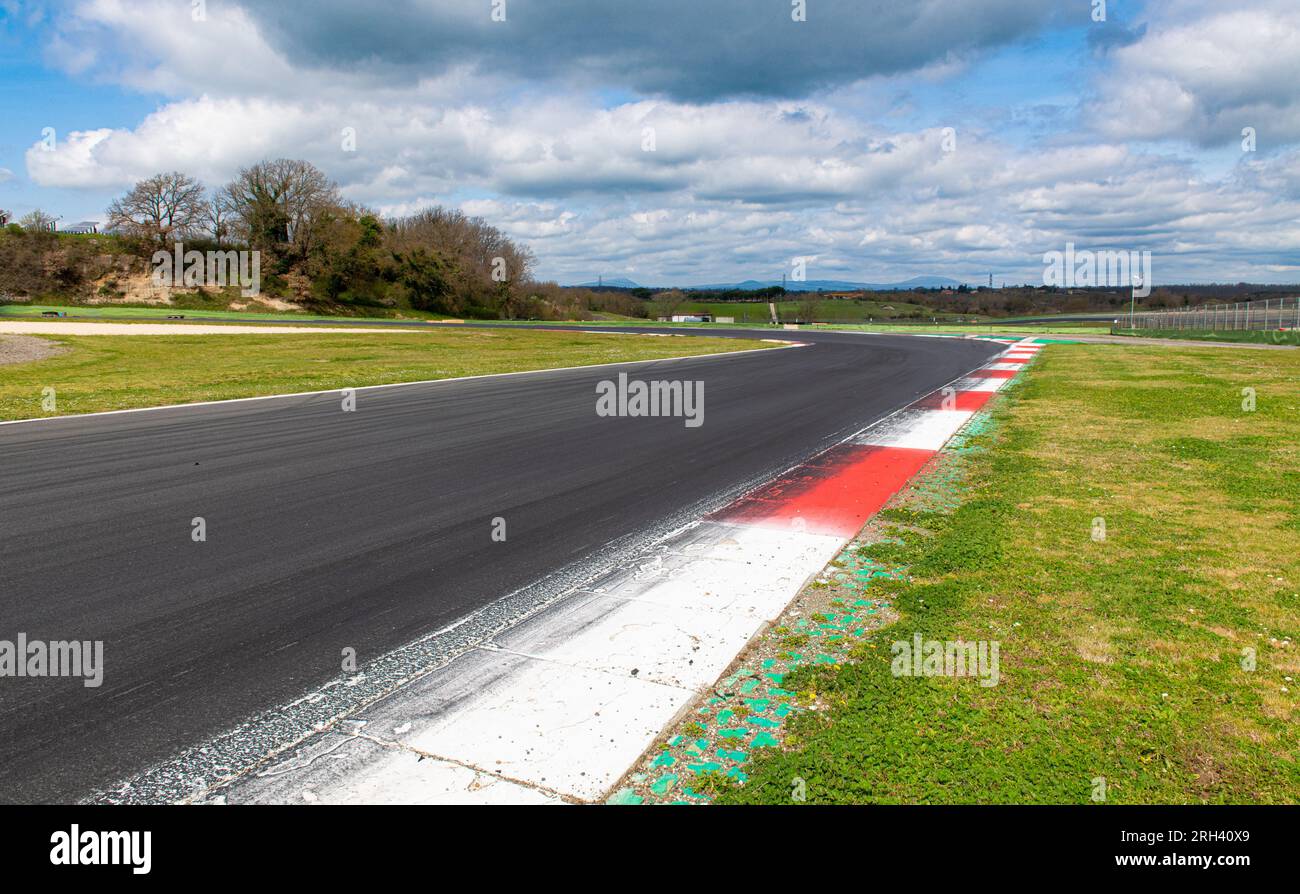 Motor sport asphalt race track and curbs with skid marks, low angle ...