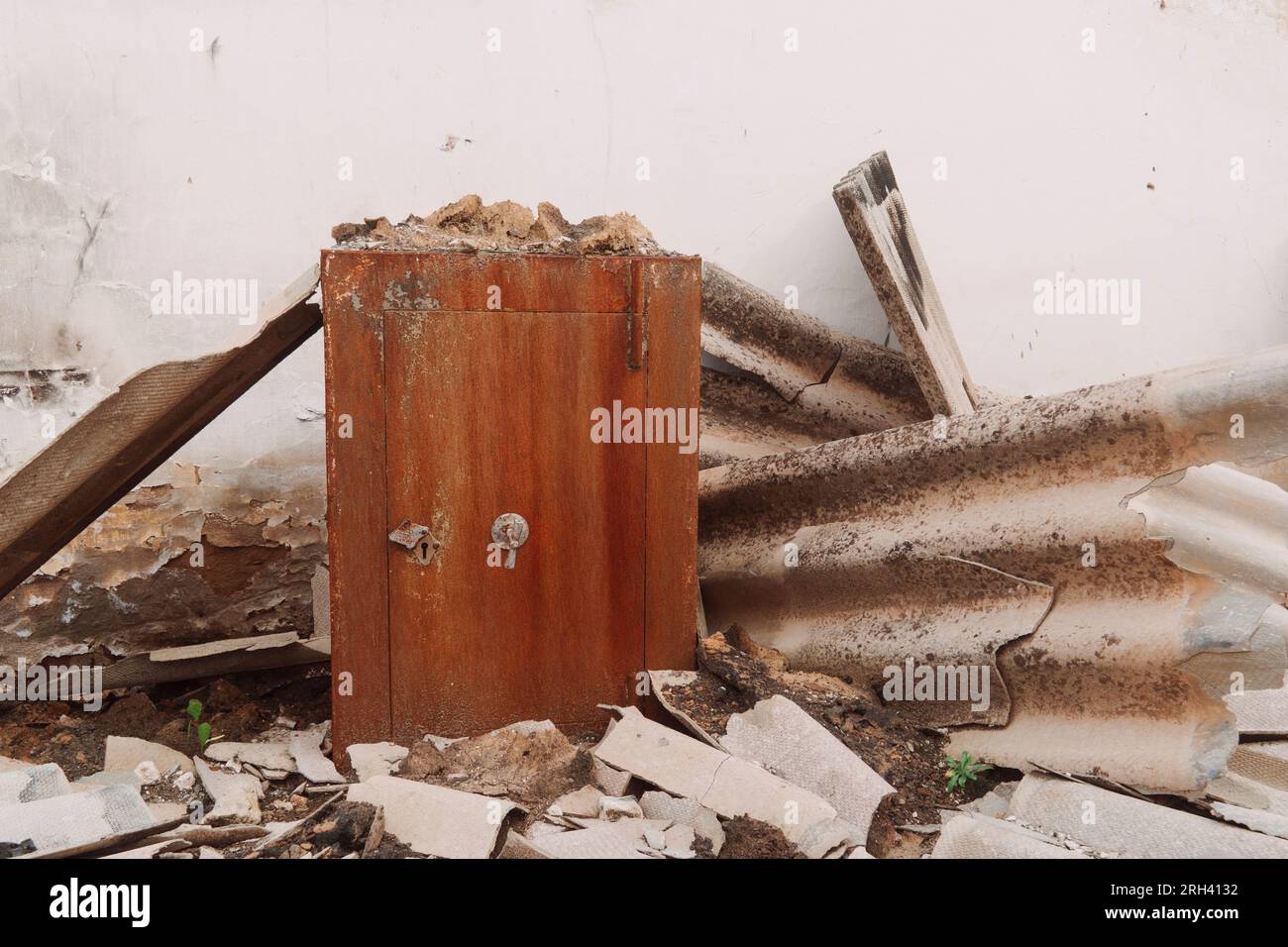 Burnt safe inside a house destroyed by shelling. War in Ukraine ...