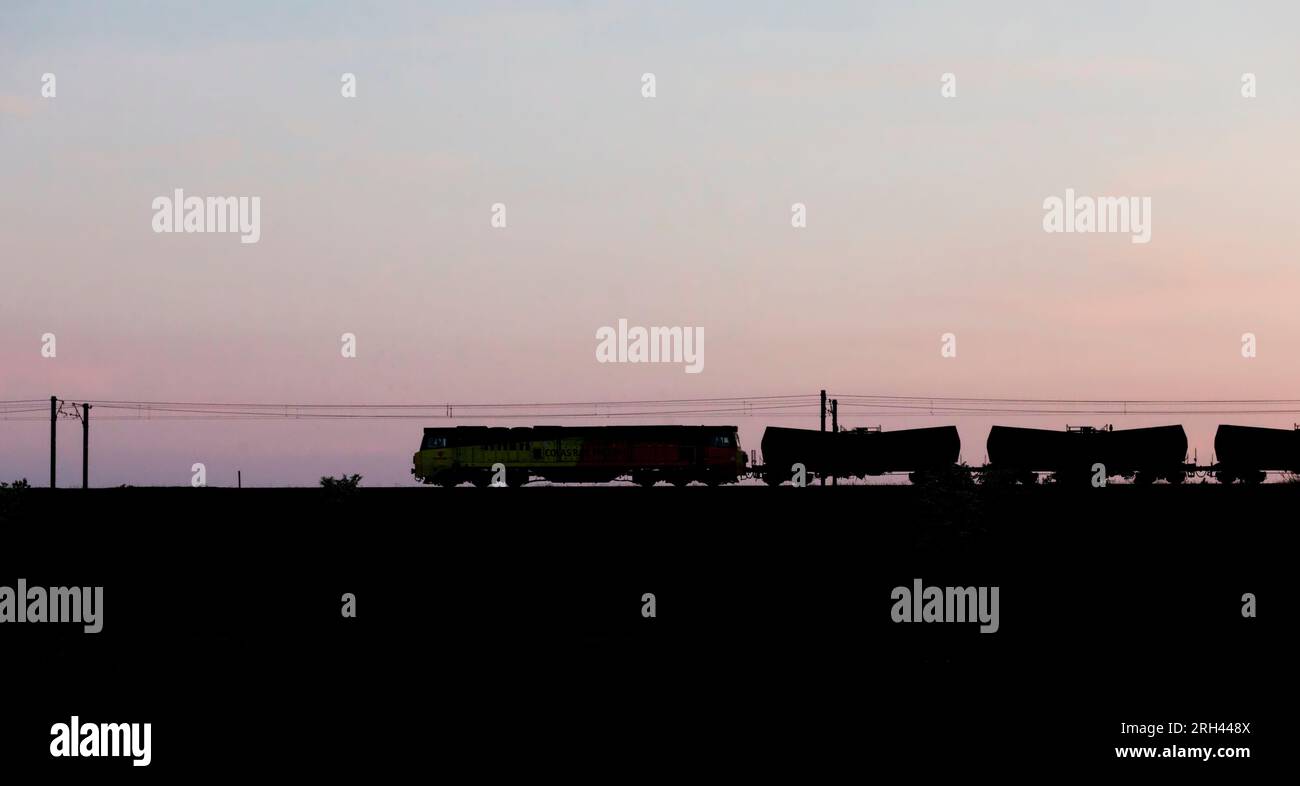 Colas Railfreight class 70 locomotive making a sunset silhouette at ...