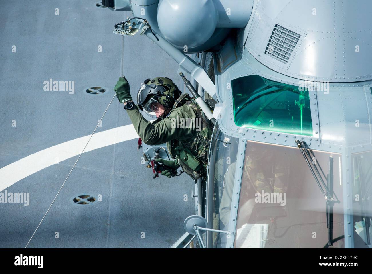 A winchman on a Seasprite helicopter onboard HMNZS Canterbury whilst ...