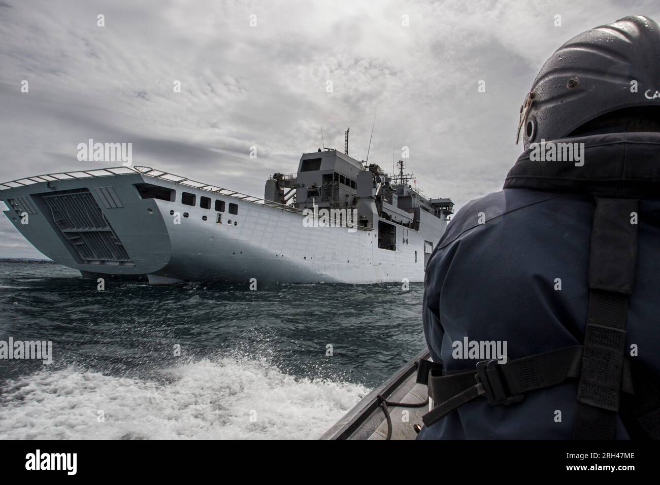 A navy RIB approaches HMNZS Canterbury whilst taking part in an ...