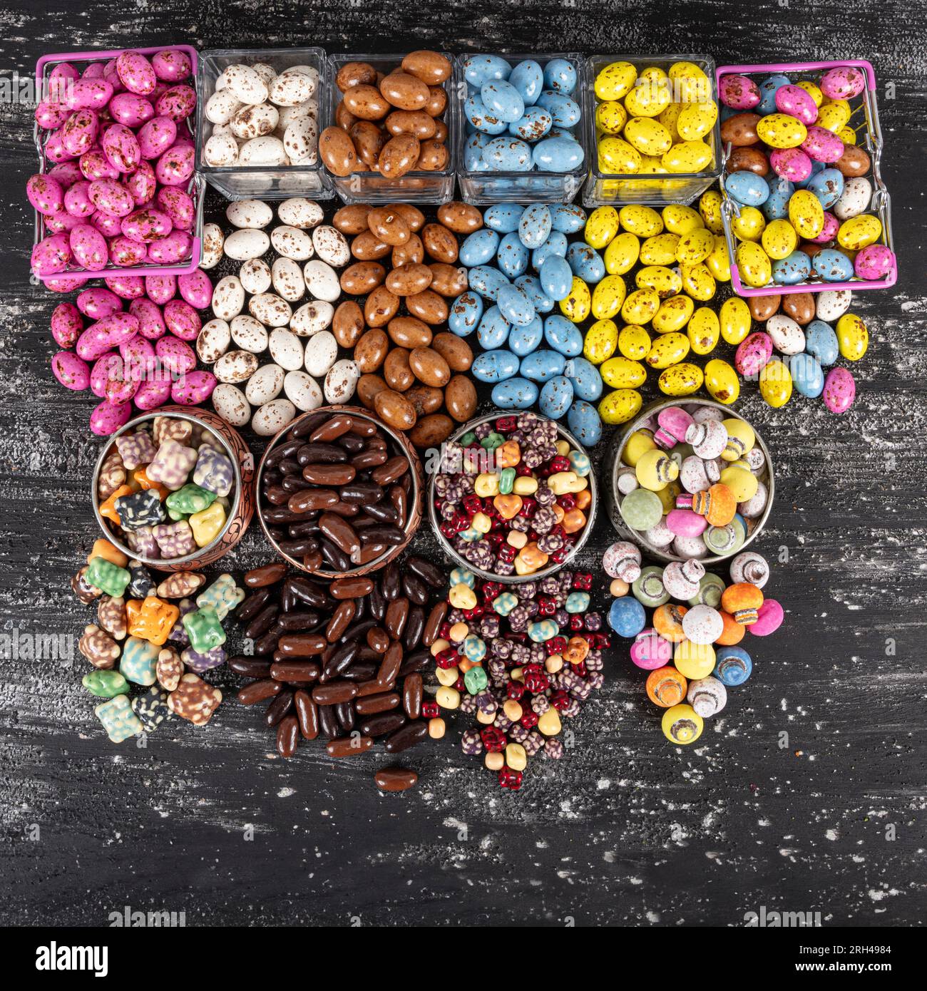 Heap of sugared almonds and hazelnuts dragees in chocolate isolated on ...