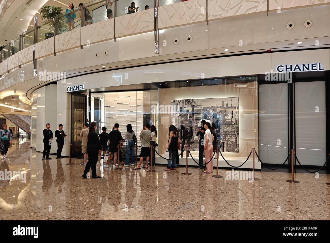 SHANGHAI, CHINA - AUGUST 13, 2023 - Customers line up in front of a ...