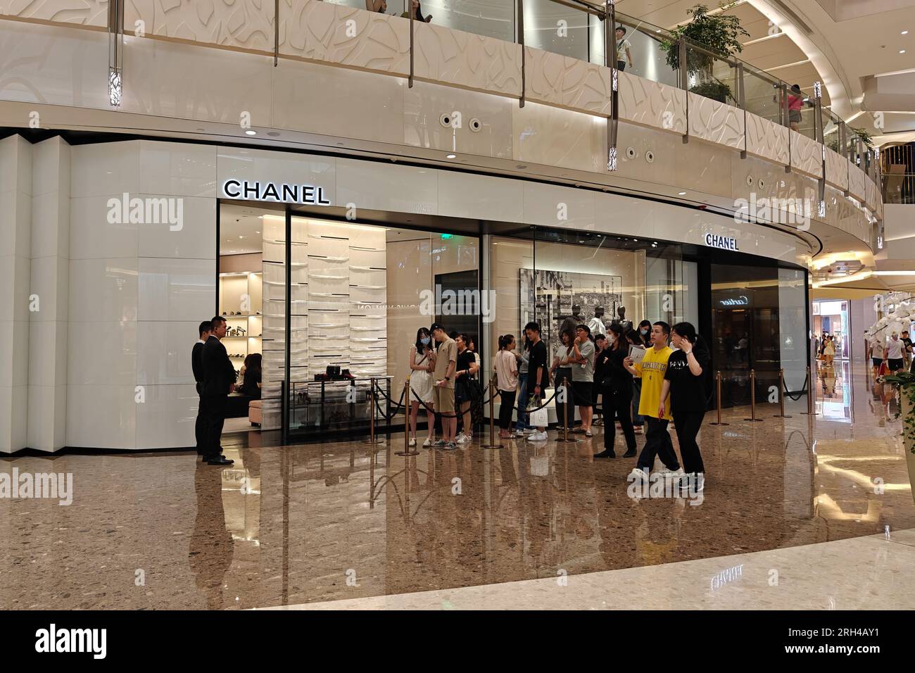 SHANGHAI, CHINA - AUGUST 13, 2023 - Customers line up in front of a ...