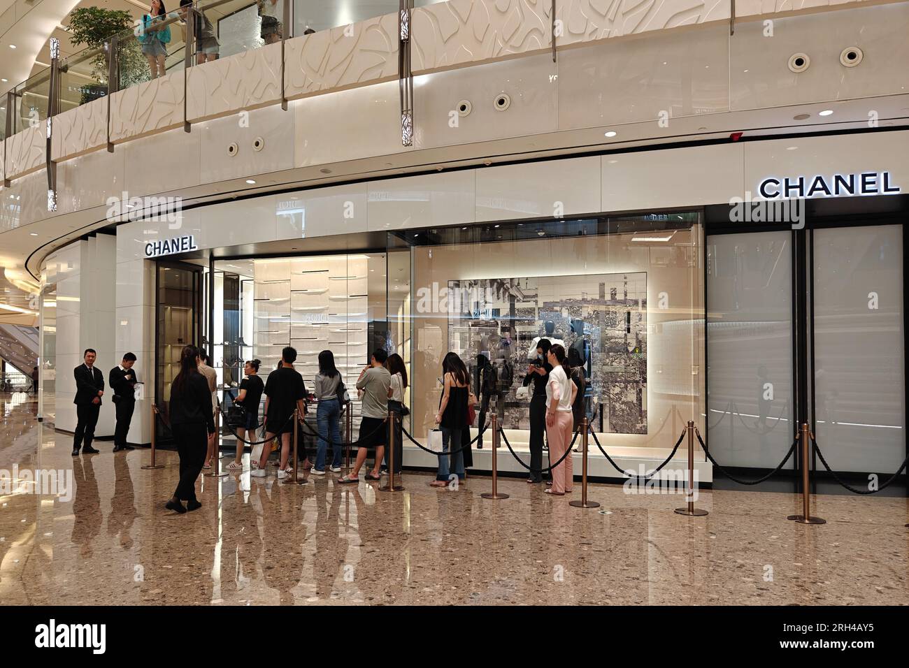 SHANGHAI, CHINA - AUGUST 13, 2023 - Customers line up in front of a ...