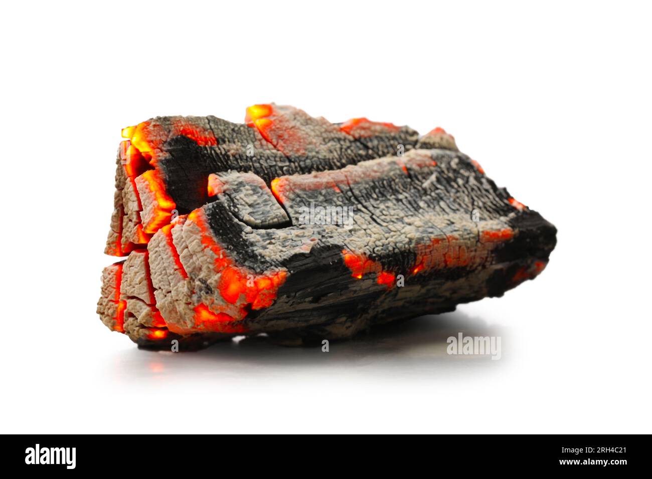 Piece of smoldering coal on white background Stock Photo - Alamy