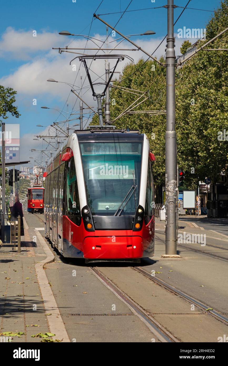 Modern tram public transport on urban street rails outside Stock Photo ...