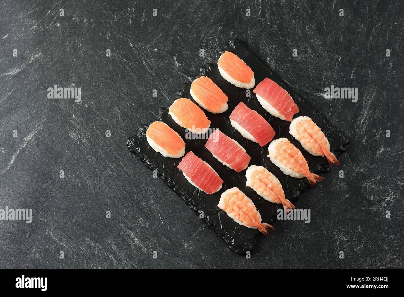 Nigiri Salmon, Tuna, and Shrimp Sushi, Top View on Black Marble Table ...
