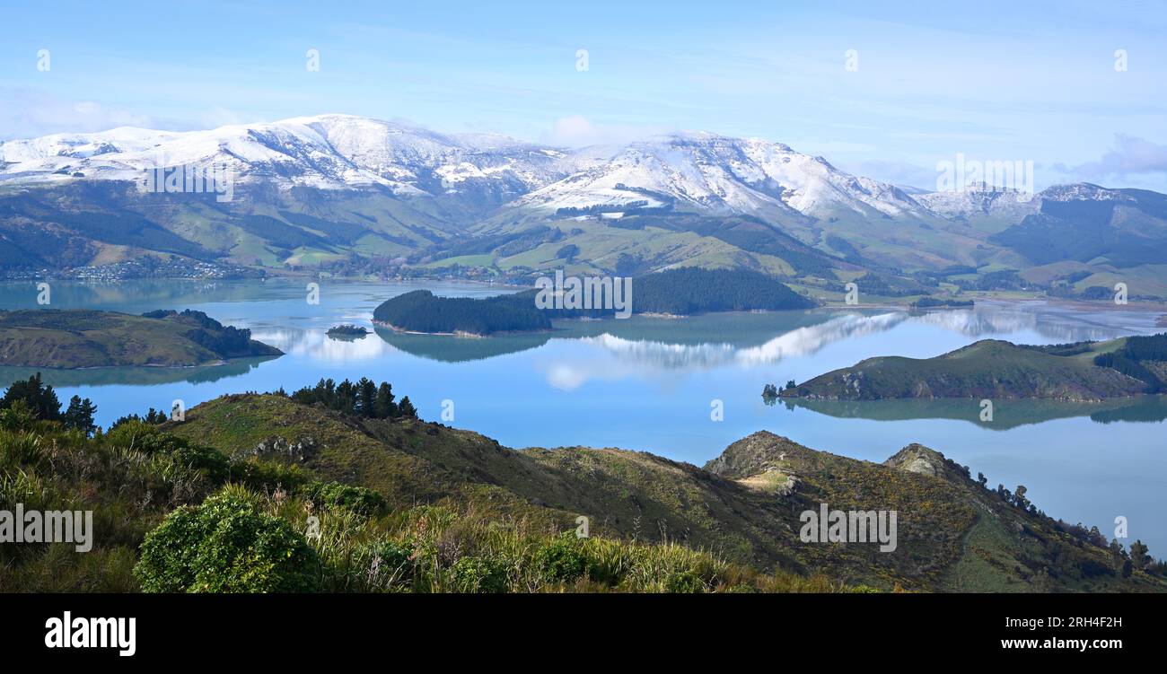 Lyttelton Harbour Winter Panorama with Snow on Mount Herbert reflected ...